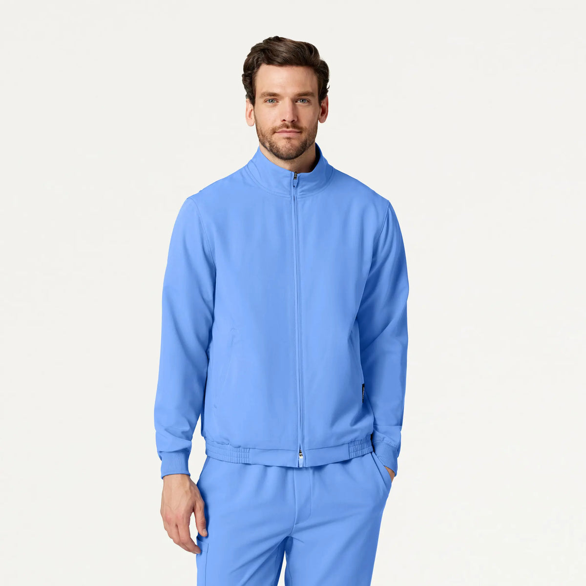 Shop Jaanuu Wolfe Everyday 6-Pocket Scrub Jacket - Ceil Blue for Men in ...